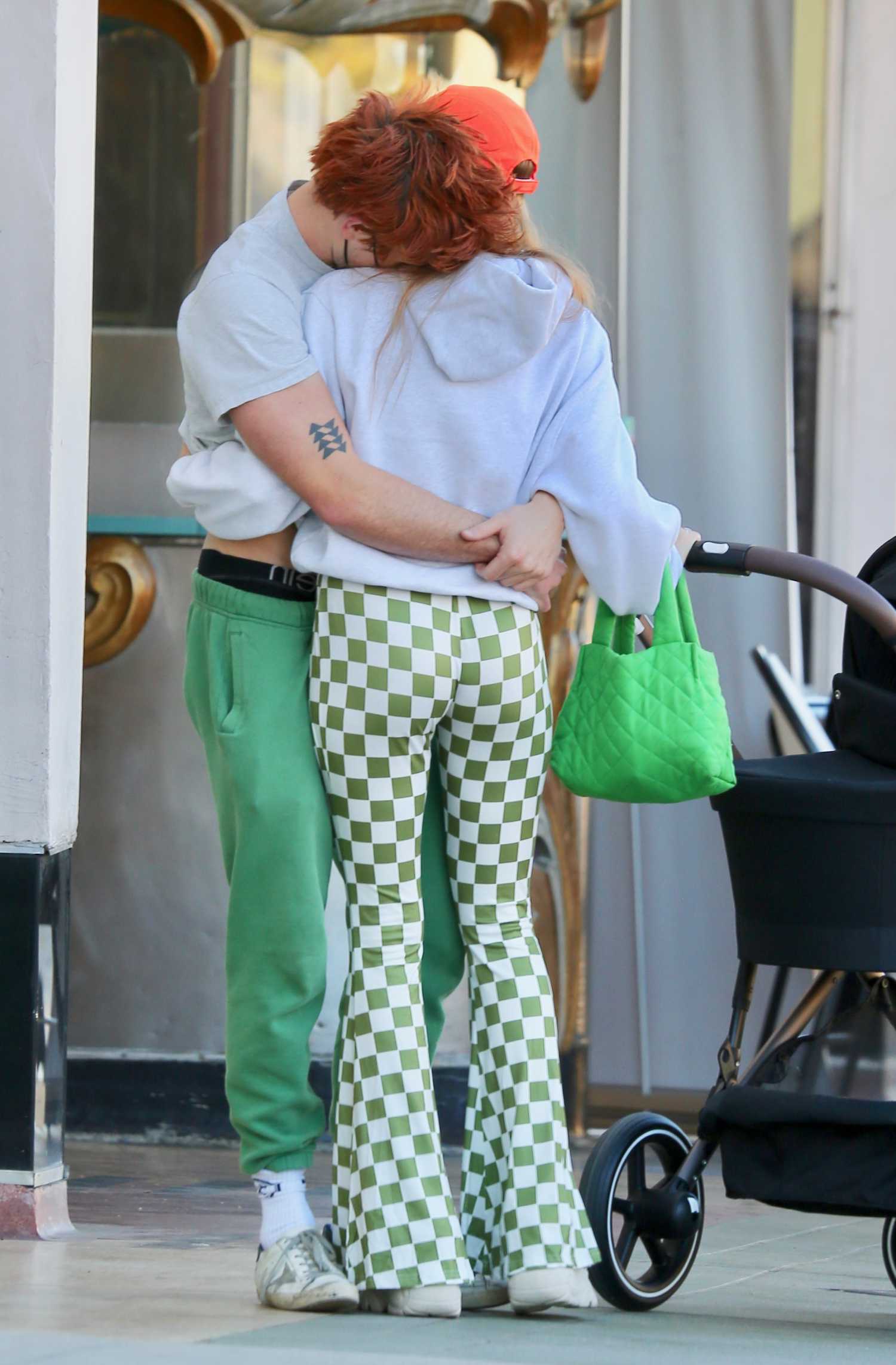 Clara Berry in a Red Cap Was Seen Out with KJ Apa and their Baby in Los ...