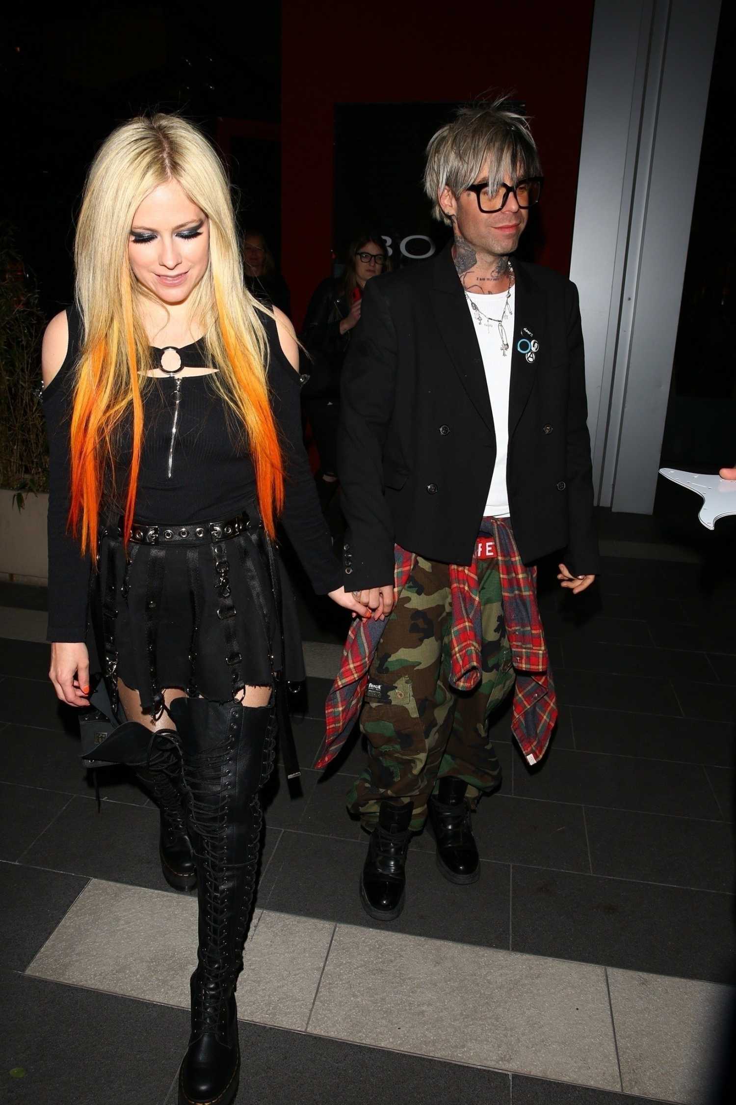 Avril Lavigne in a Black Mini Skirt Has Dinner with Mod Sun at BOA ...