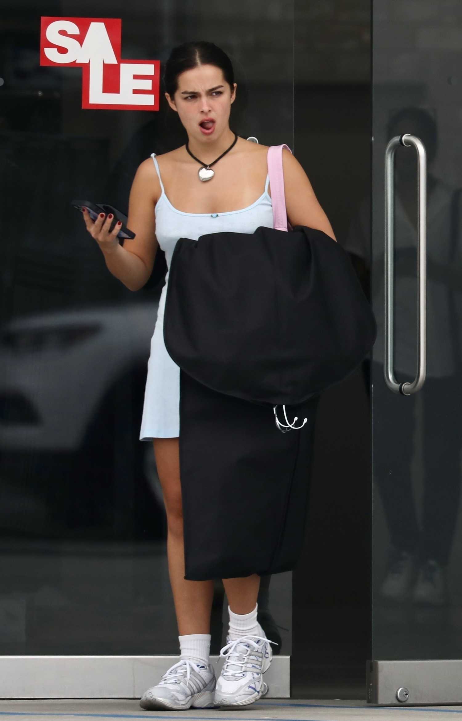 Addison Rae in a White Mini Dress Goes Shopping at Dover Street Market ...