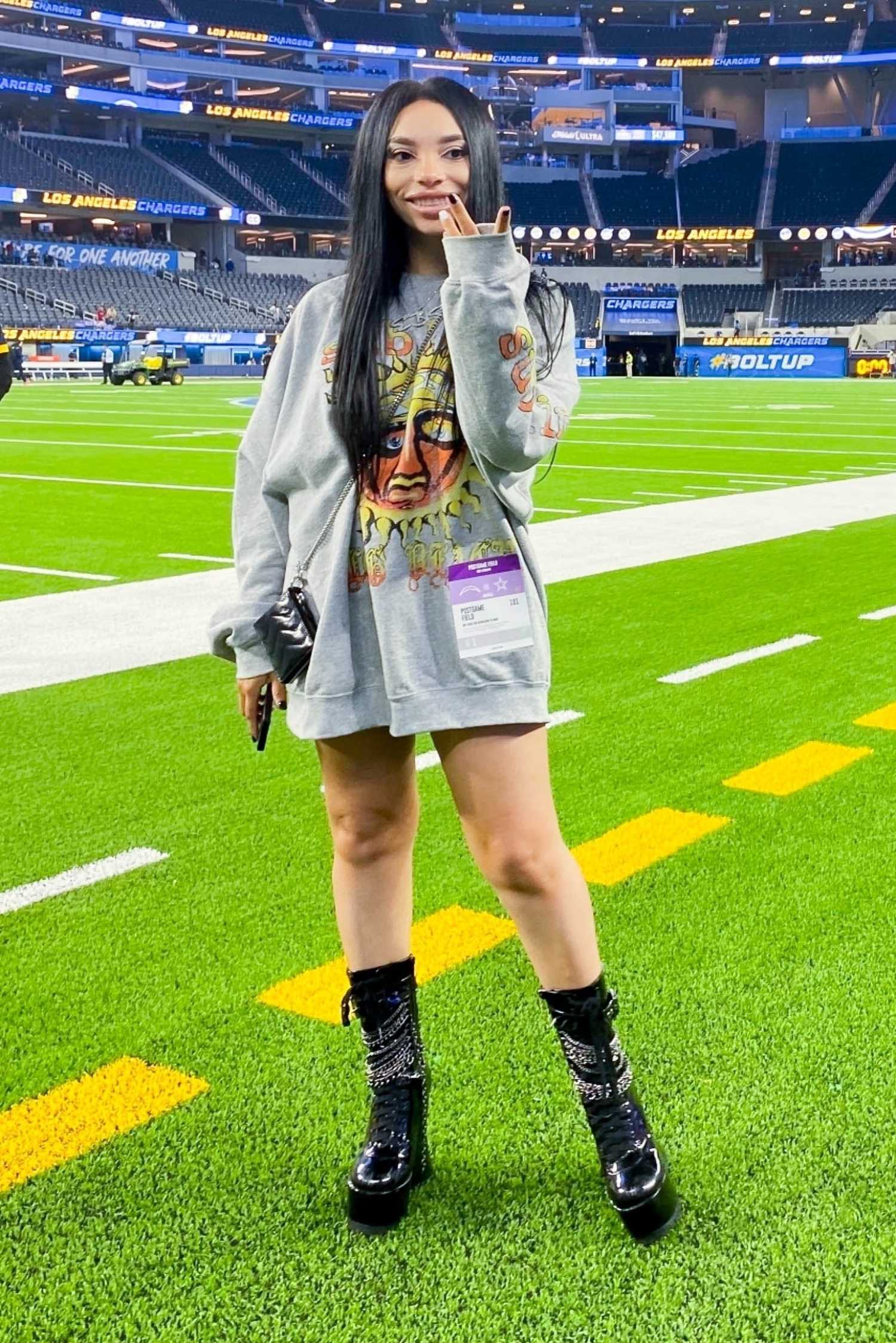 Ebie Wright in a Grey Sweatshirt Poses at the LA Chargers vs Dallas ...