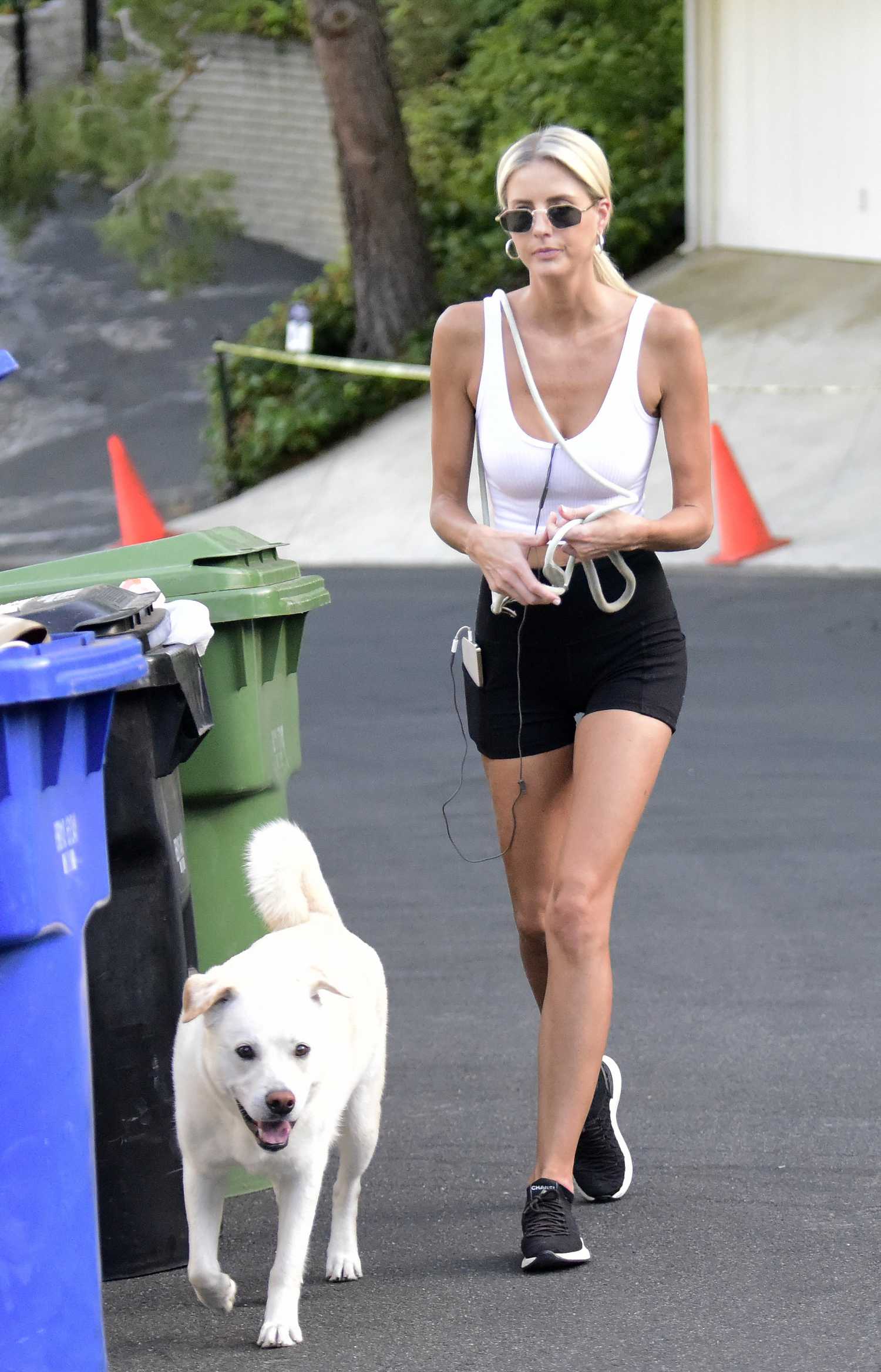 Emma Hernan in a White Top Walks Her Labrador Retriever in Los Angeles ...