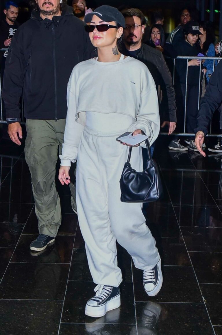 Demi Lovato in a Black Cap Arrives at the Galeao Airport in Rio de ...