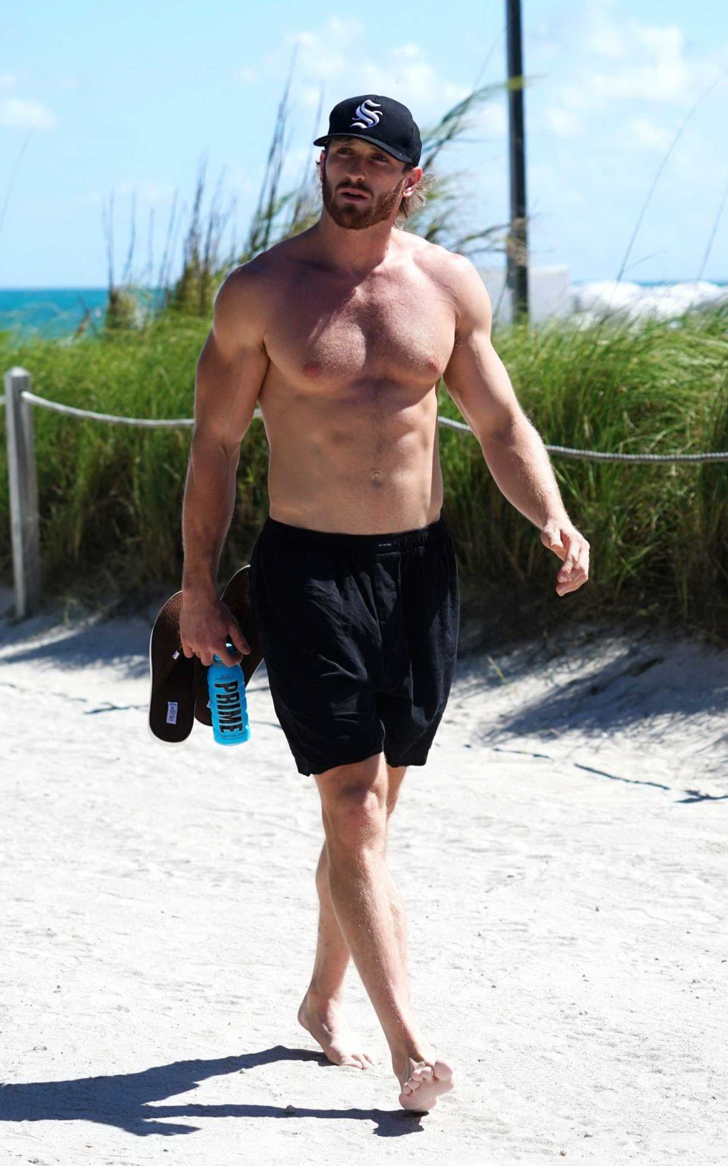 Logan Paul in a Black Shorts Was Seen Out with Nina Agdal on the Beach ...