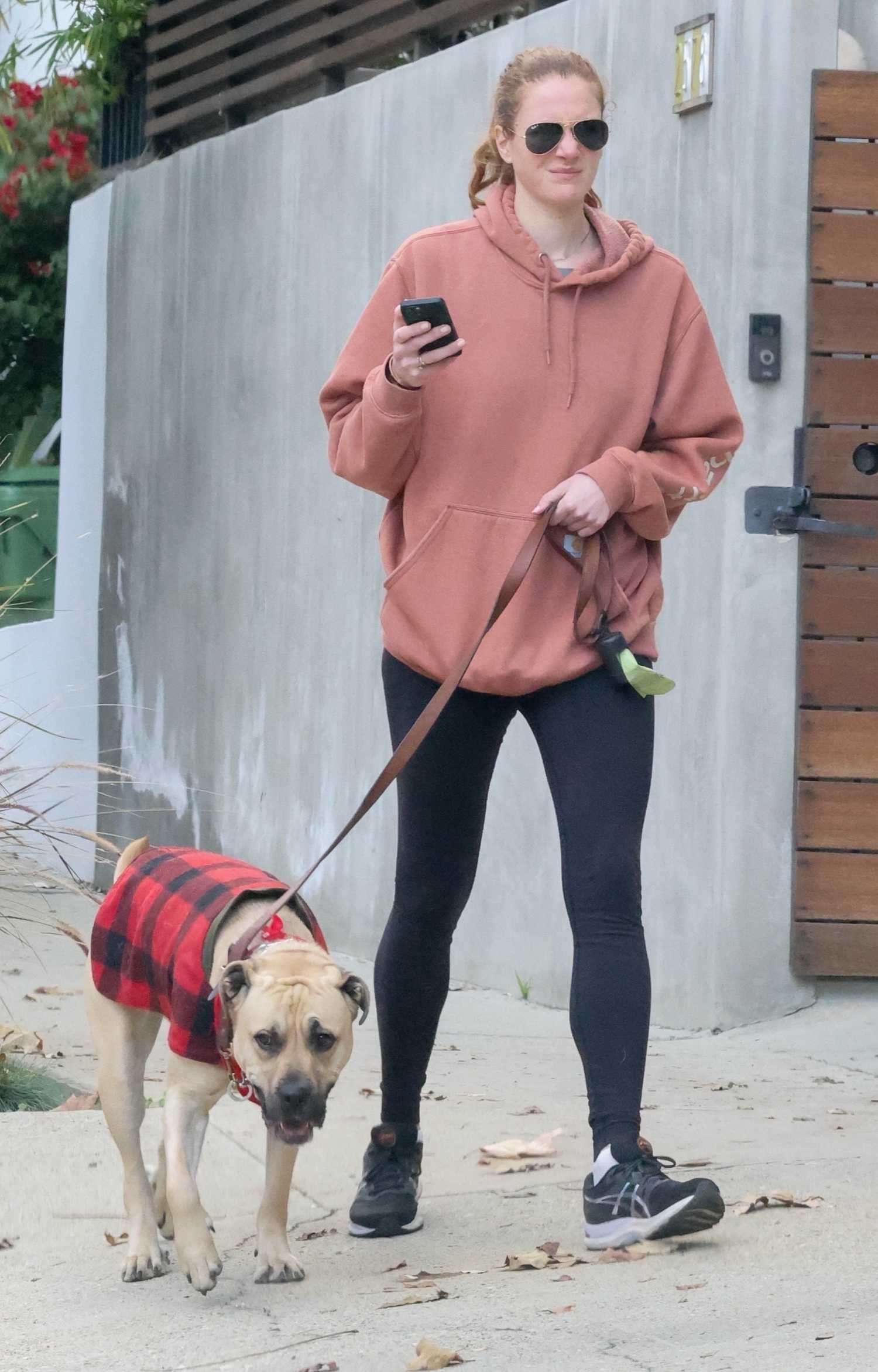 Anna Osceola in a Black Sneakers Walks Her Dog Near Her Home in Los ...