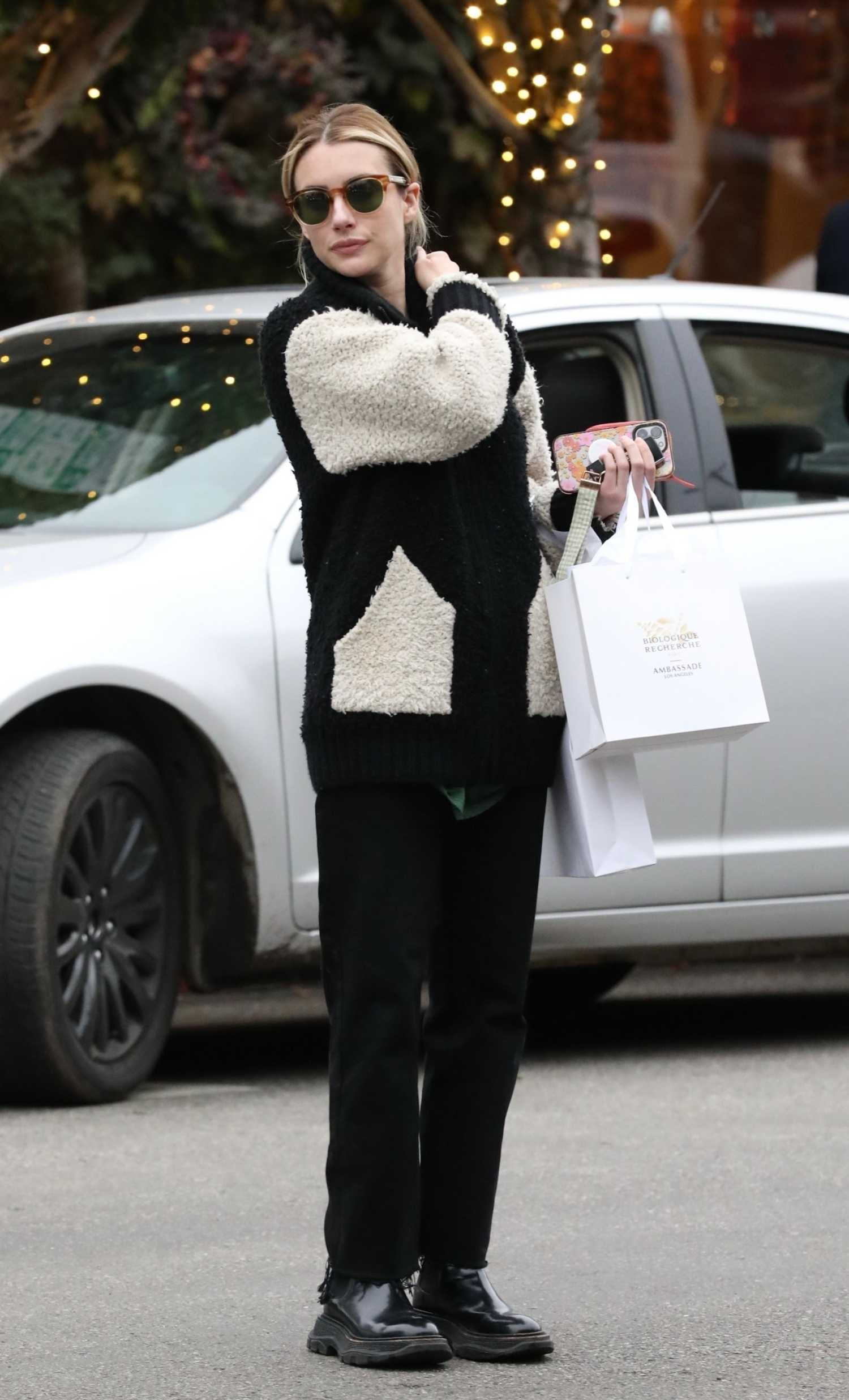 Emma Roberts in a Black Pants Enjoys Some Solo Christmas Shopping ...