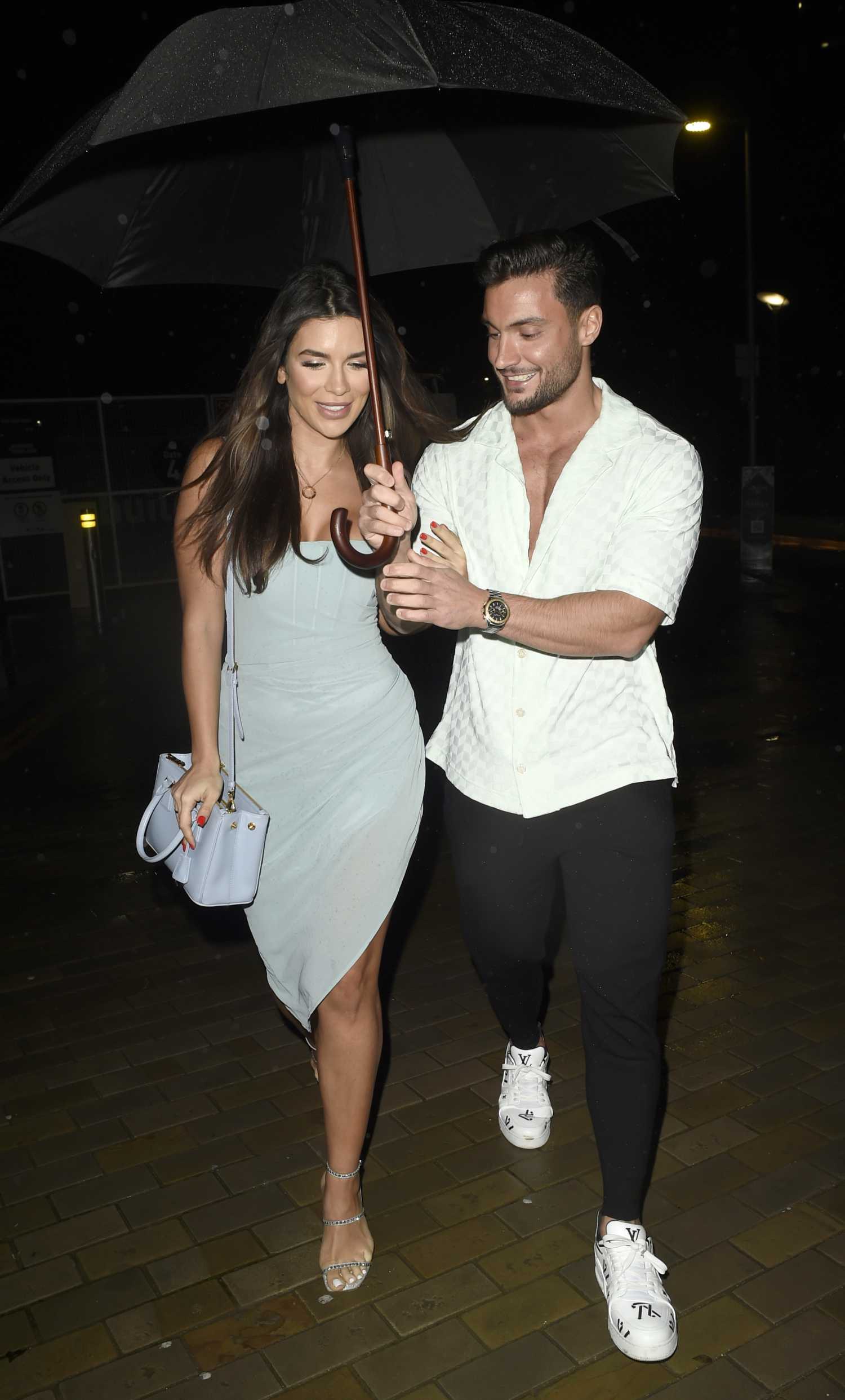 Ekin-Su Cülcüloğlu in a Baby Blue Dress in the Rain on New Year Date ...