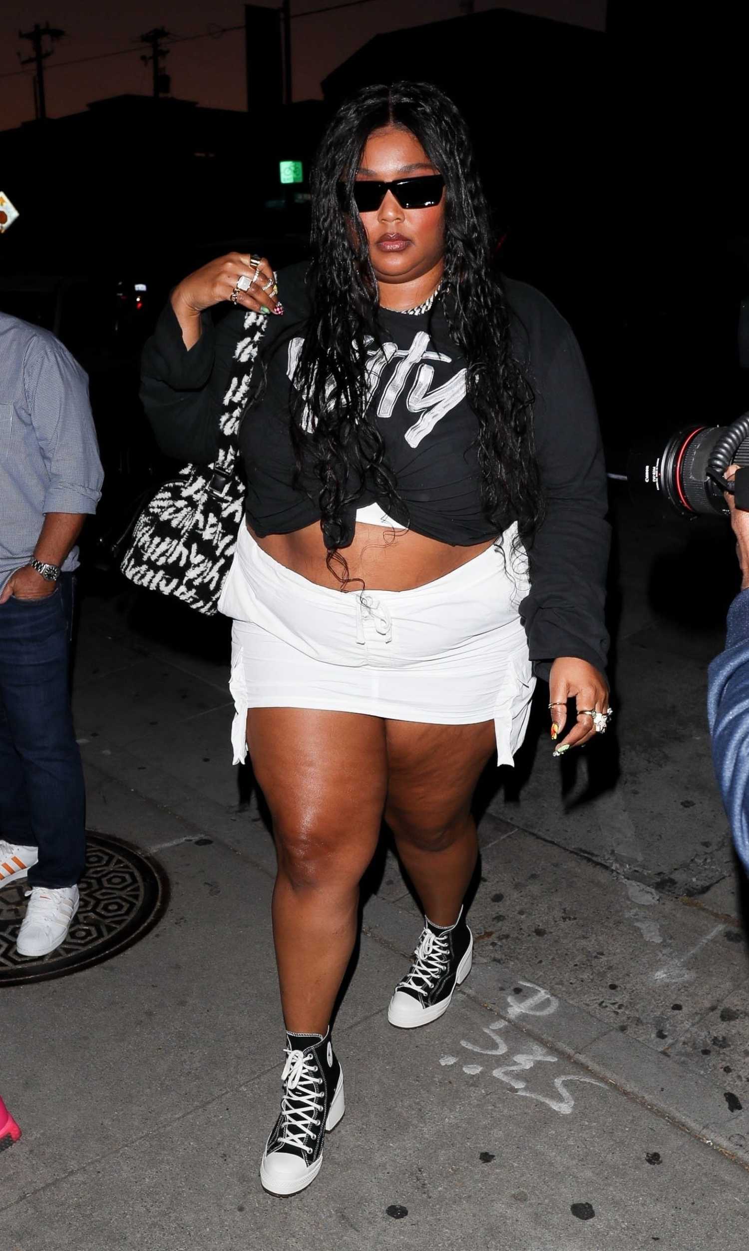 Lizzo in a White Mini Skirt Arrives at Craig’s for a Late-Night Dinner ...