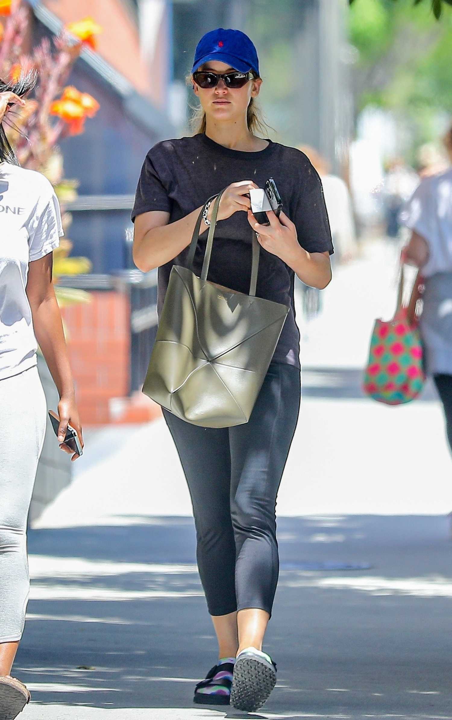 Jennifer Lawrence in a Blue Cap Heads to a Pilates Studio with a Friend ...
