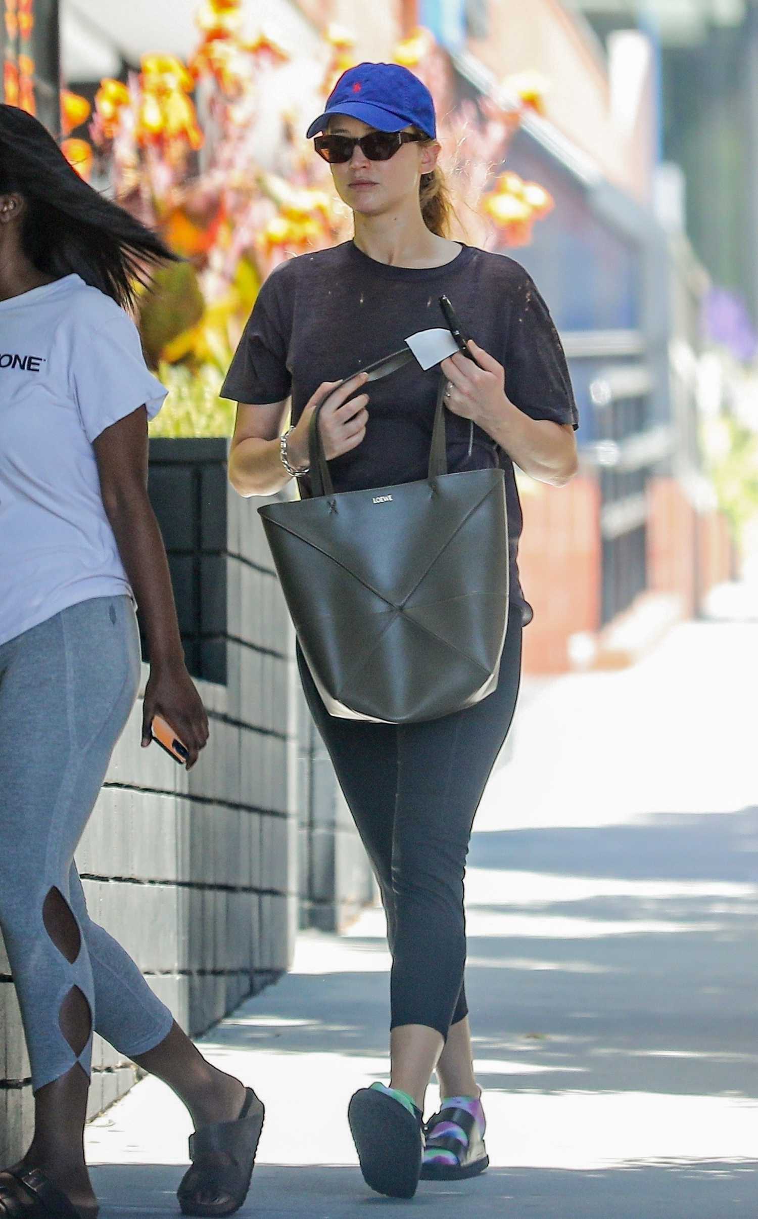 Jennifer Lawrence in a Blue Cap Heads to a Pilates Studio with a Friend ...